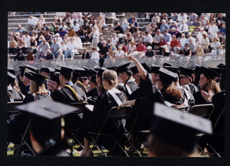 Graduates seated, female holding up hand | Lehigh Preserve