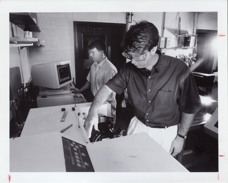 Graduate Student Paul Mumbaur, assistant professor of chemistry Gregory ...