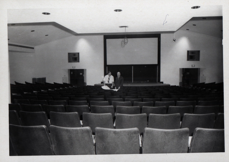 John Karakash and two other men looking at plans in Packard Auditorium | Lehigh Preserve