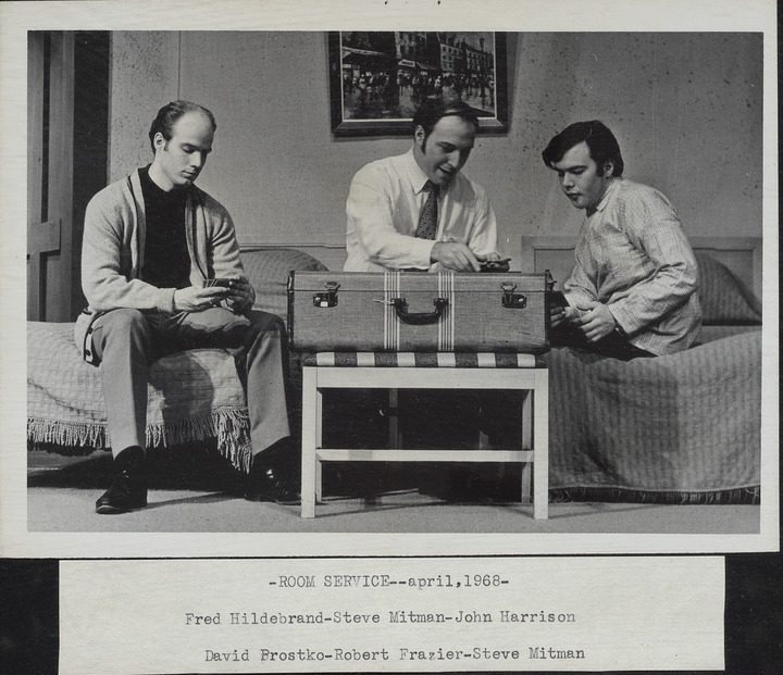 Two black and white photos, A. Men playing cards on top of suitcase ...