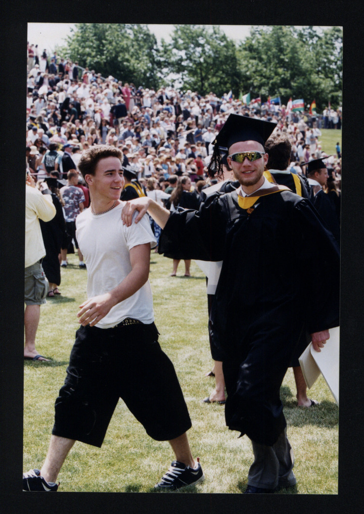 Male graduate walking with another male | Lehigh Preserve