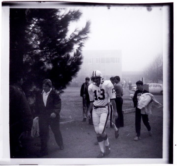 Lehigh fans walk alongside football player #13 | Lehigh Preserve