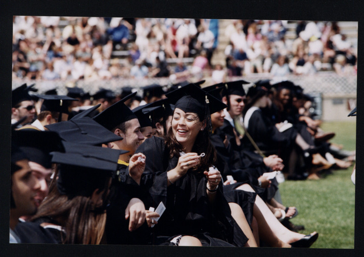 Female graduate getting ready to blow bubbles | Lehigh Preserve